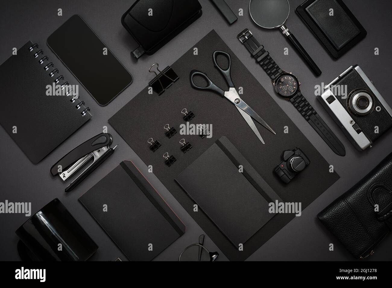 Black objects from the office on a dark gray background. Work an Stock ...