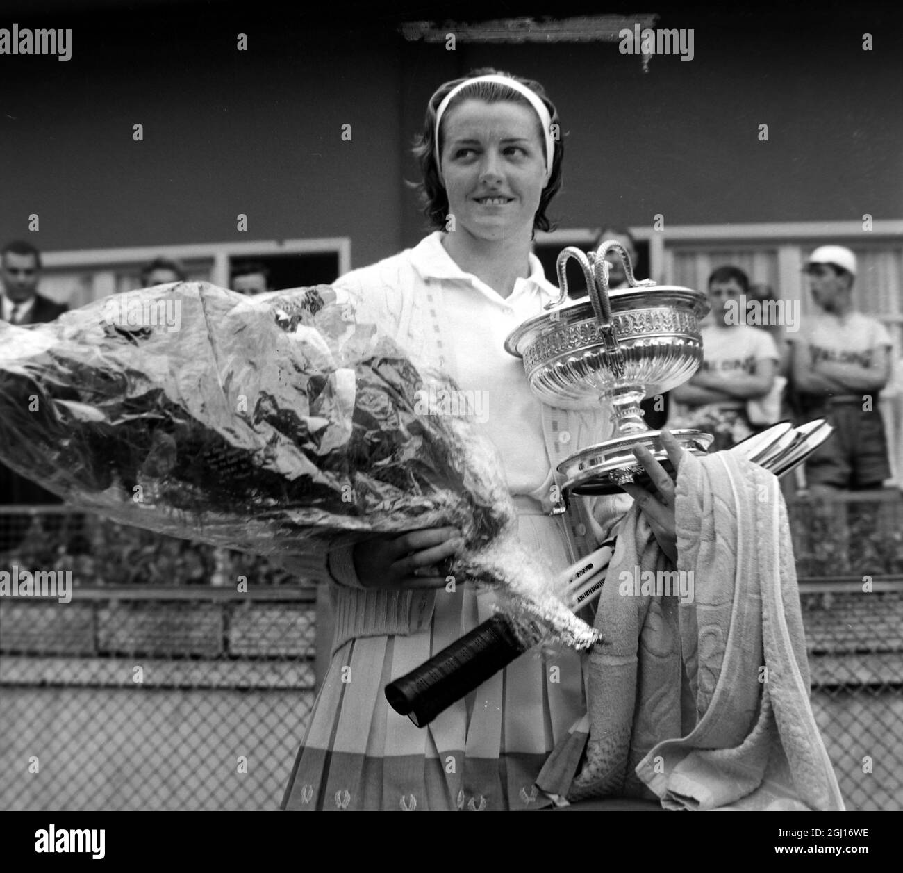 TENNIS PLAYER MARGARET SMITH HOLDS TROPHY AND FLOWERS AFTER WINNING ...