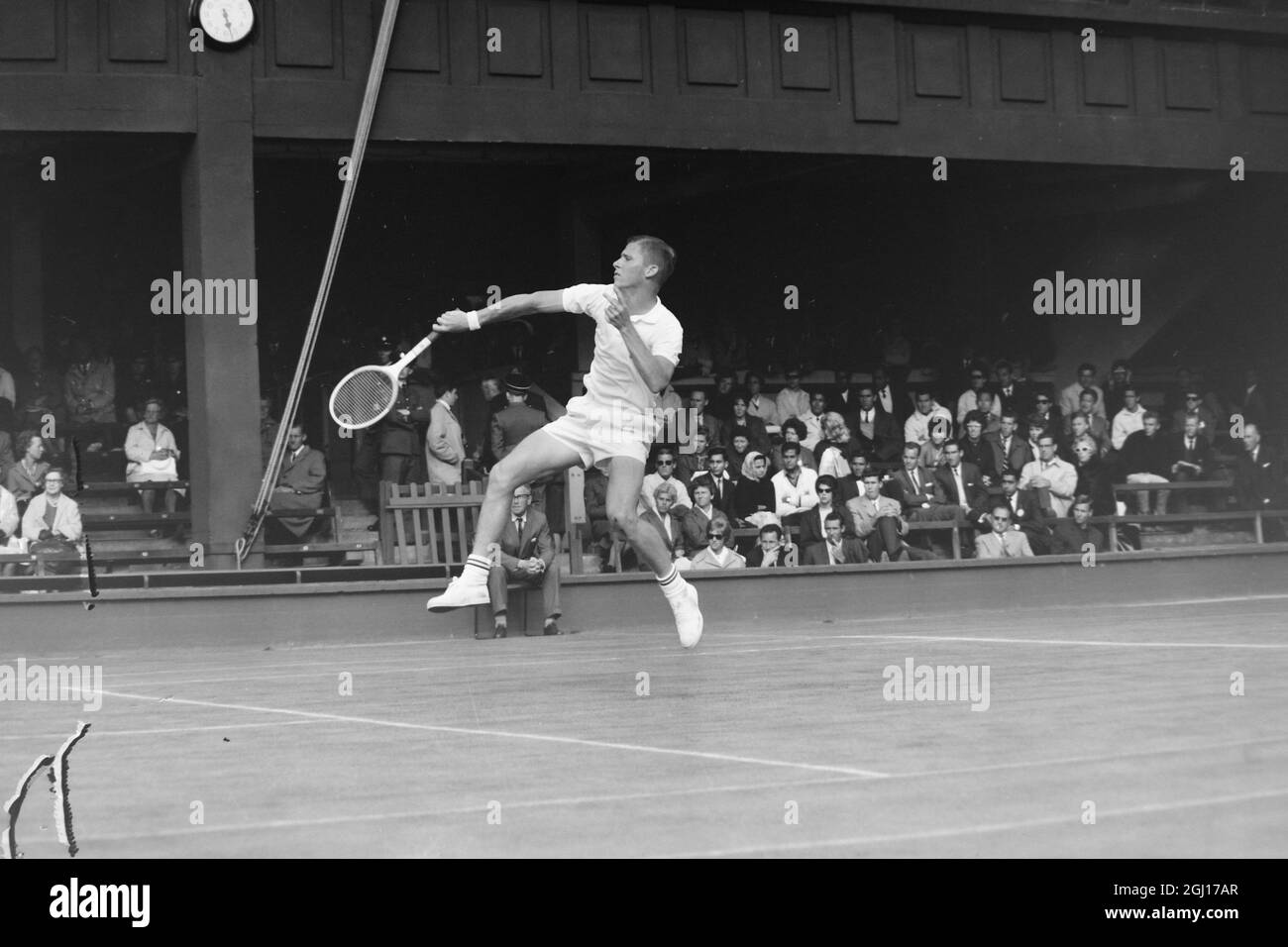 DENNIS RALSTON IN ACTION AT TOURNAMENT IN WIMBLEDON INTERNATIONAL ...