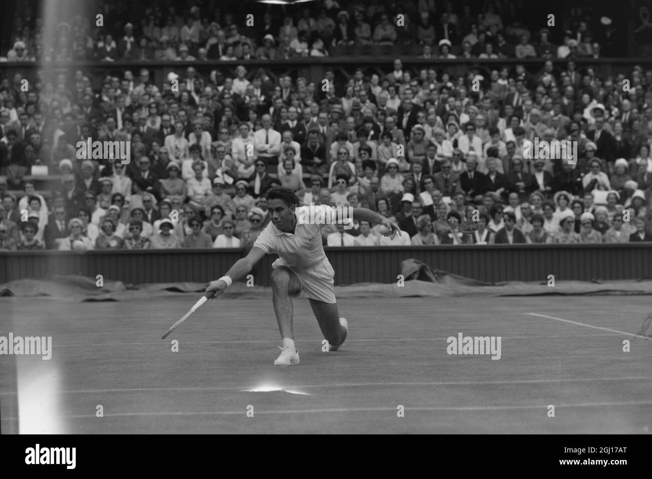 MANUEL SANTANA IN ACTION AT TOURNAMENT IN WIMBLEDON INTERNATIONAL ...