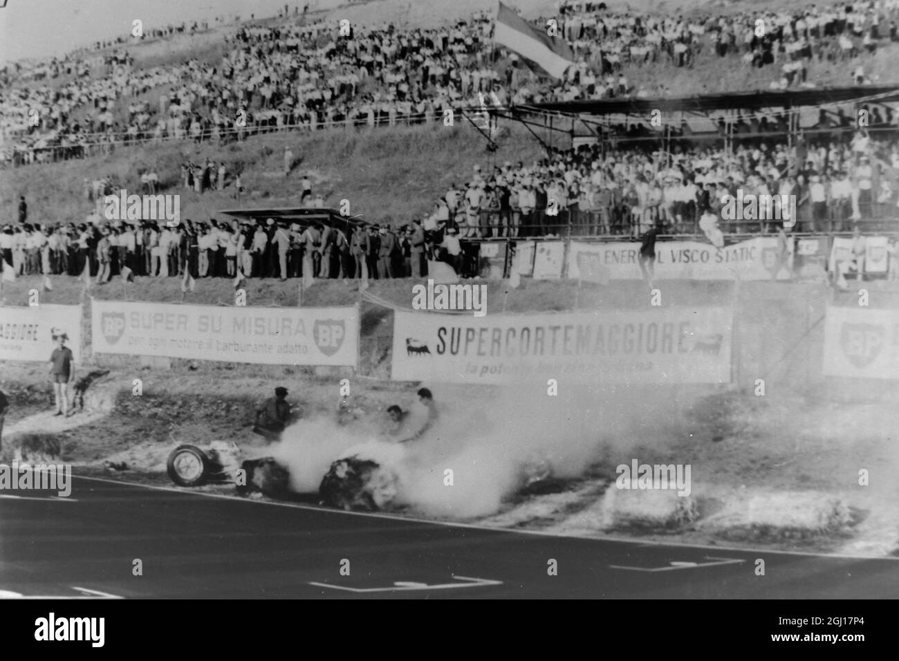 BRITISH RACING DRIVER TREVOR TAYLOR ESCAPES FROM BLAZING CAR AT GRAND ...