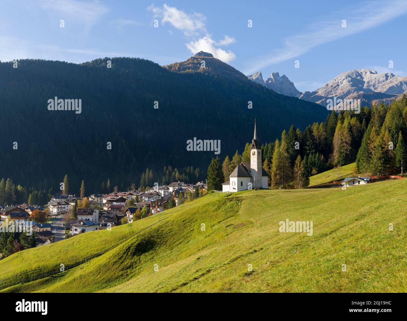 The church, in the background Focobon mountain range in the Pale di San ...