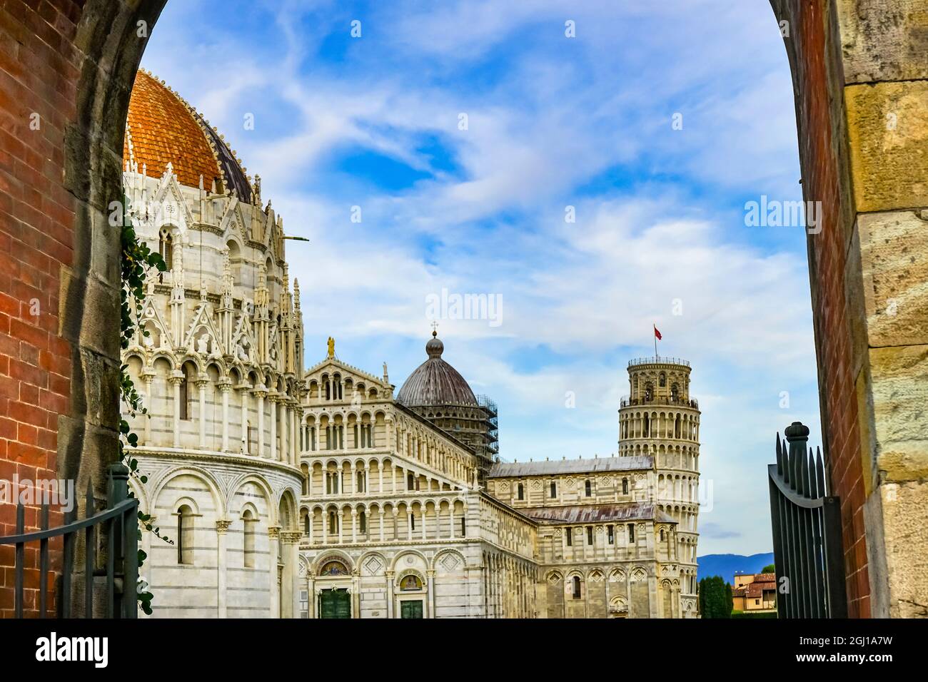 City gate of Piazza del Miracoli with Leaning Tower of Pisa and Pisa ...
