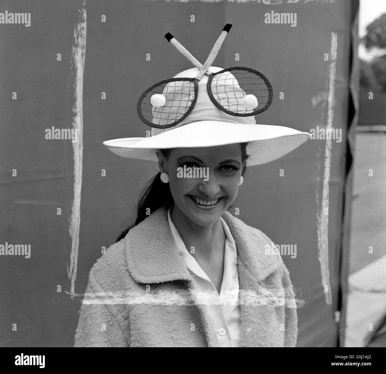 Spectator wearing straw hat Black and White Stock Photos & Images - Alamy