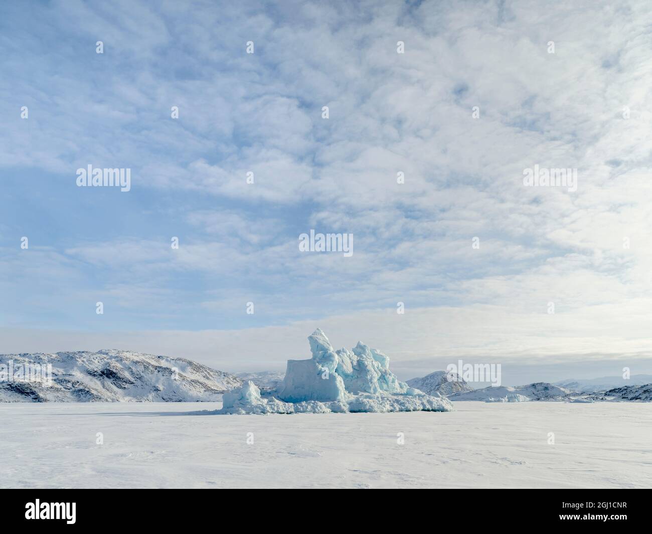 Icebergs frozen into the sea ice of the Uummannaq Fjord System near ...
