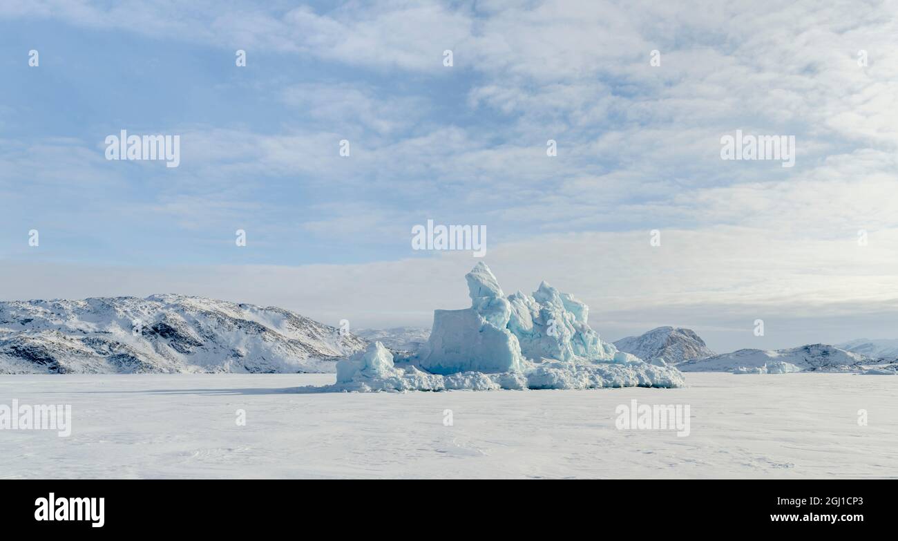 Icebergs frozen into the sea ice of the Uummannaq Fjord System near ...