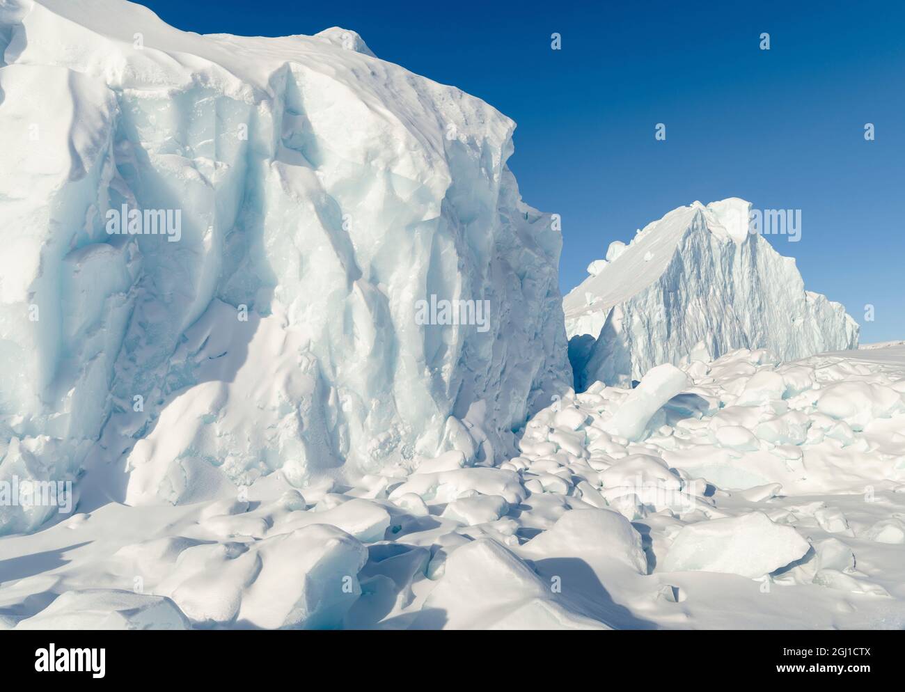 Icebergs frozen into the sea ice of the Uummannaq Fjord System near ...