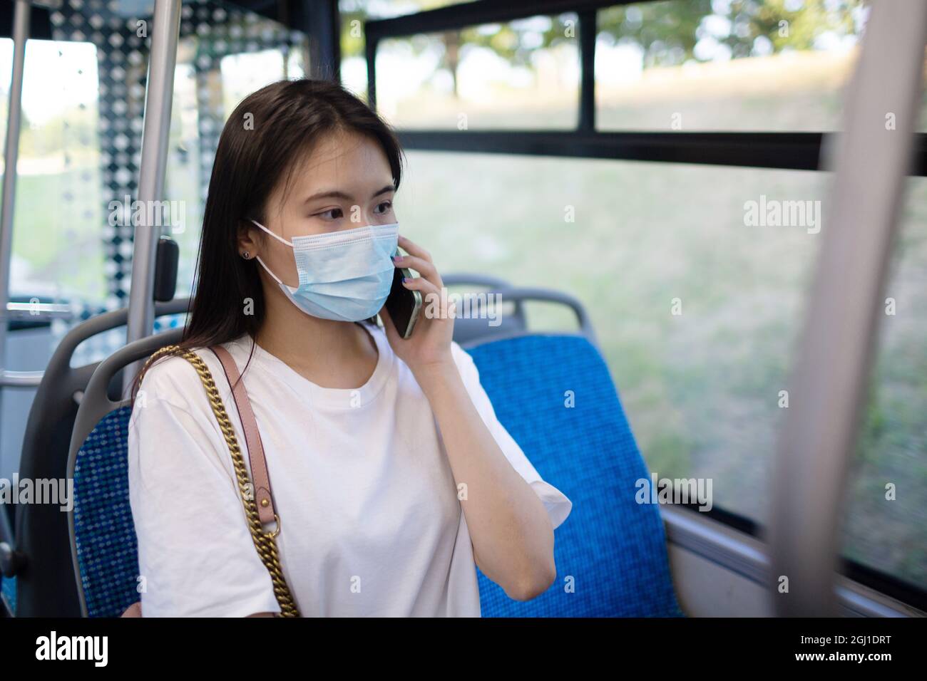 Asian Woman take a ride sit in public transport bus or tram Stock Photo ...
