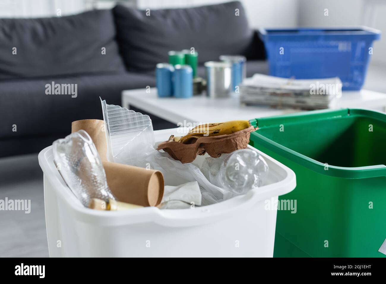 Plastic and paper trash in can at home Stock Photo - Alamy