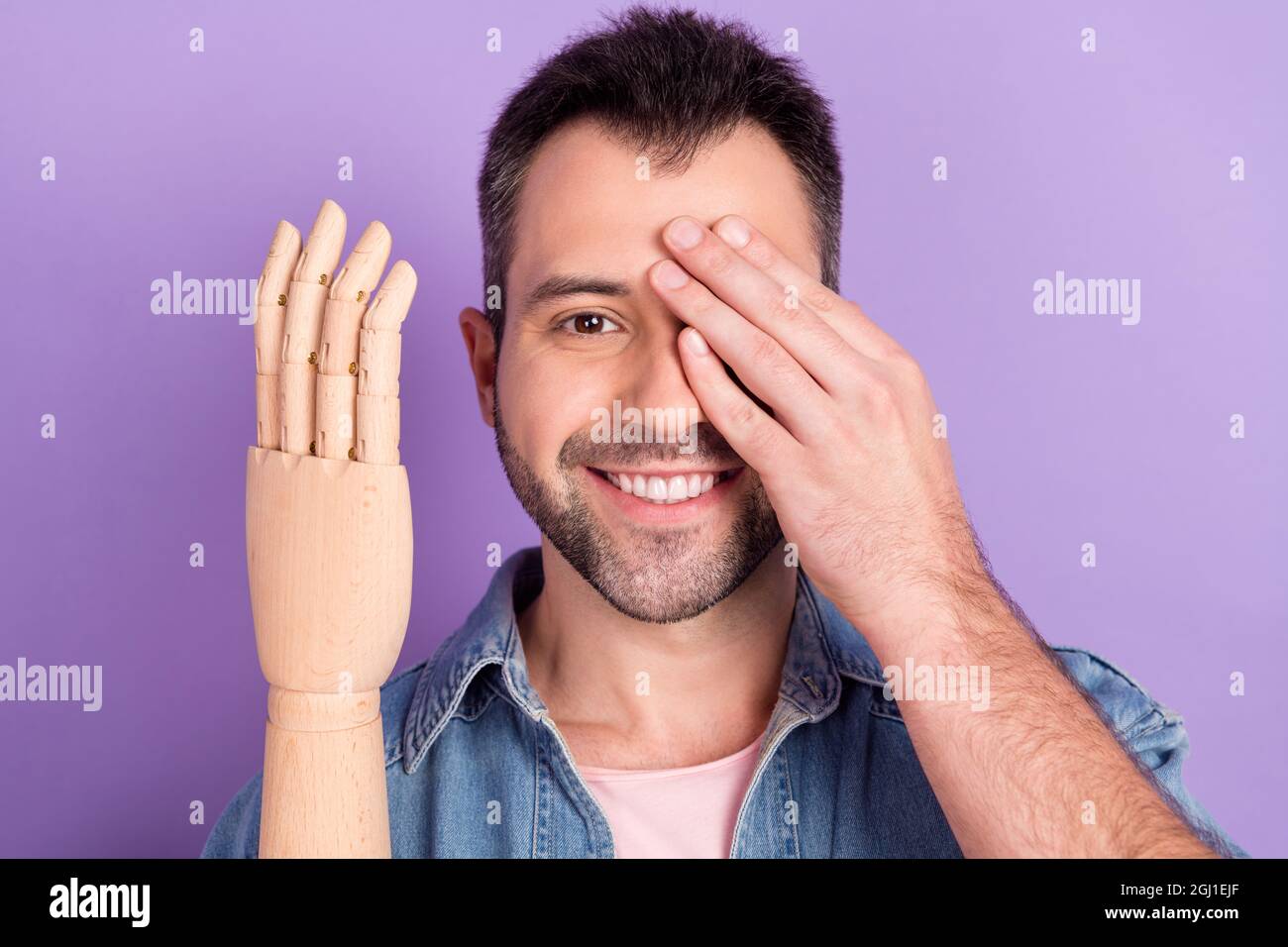 Photo of young man happy positive smile close eye hand show prosthesis ...