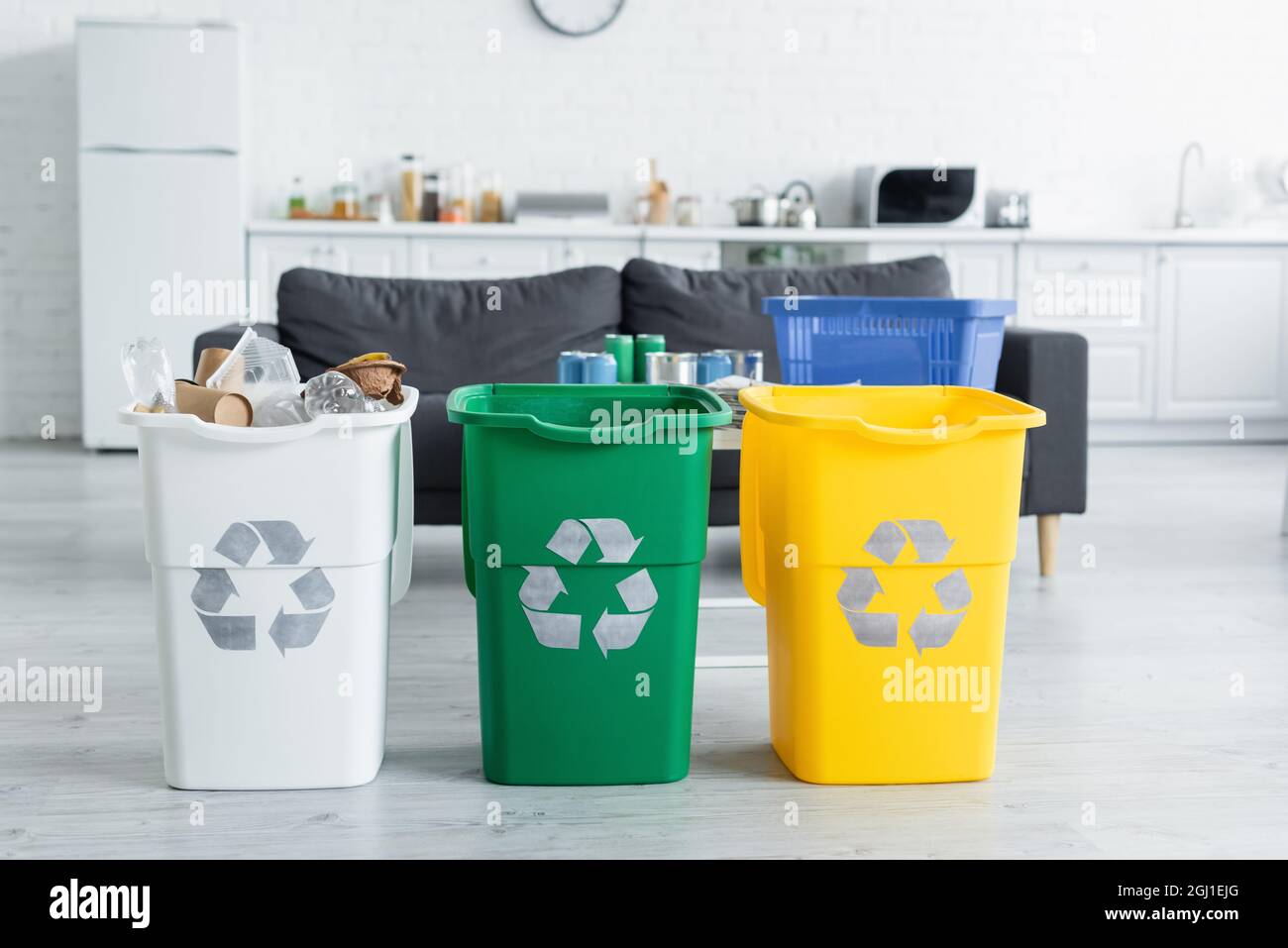 Trash cans with recycle sign in kitchen Stock Photo - Alamy