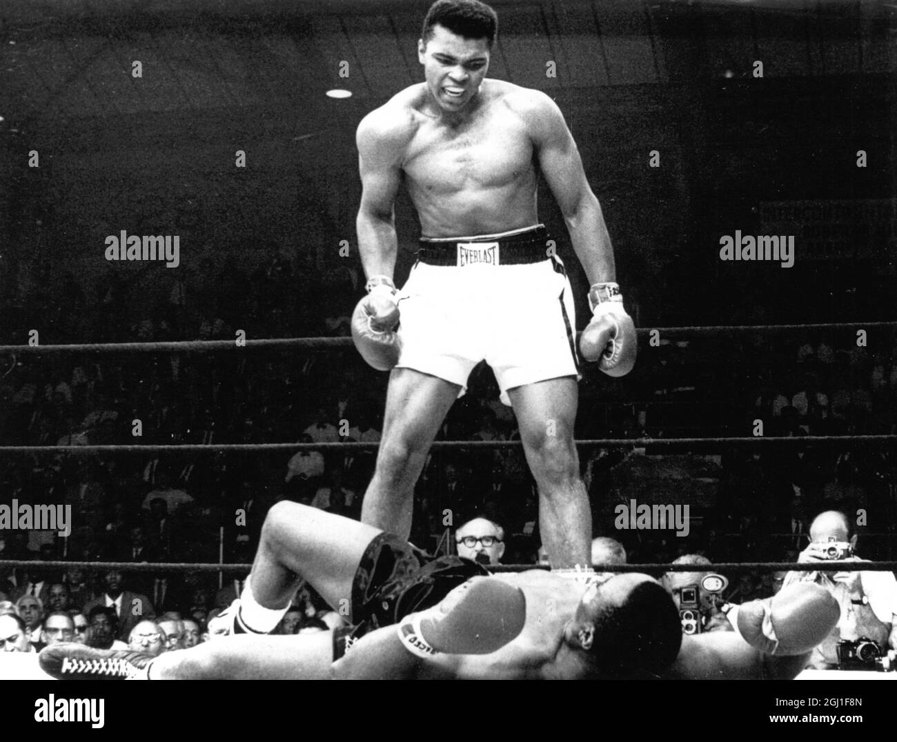 (Muhammad Ali) Cassius Clay in the boxing ring standing over Sonny ...