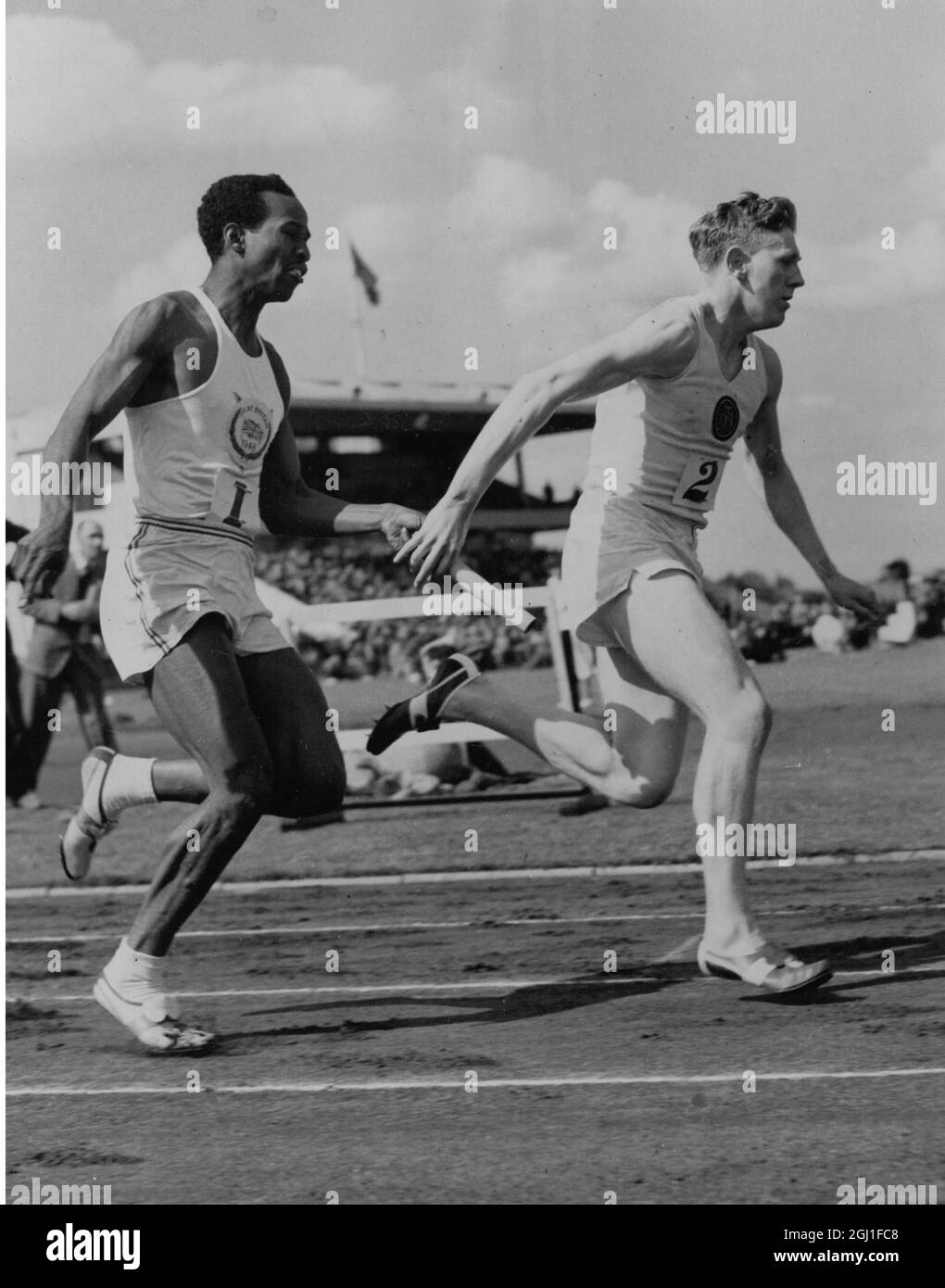Emmanuel McDonald Bailey hands over the baton to G Ellis Chiswick ...