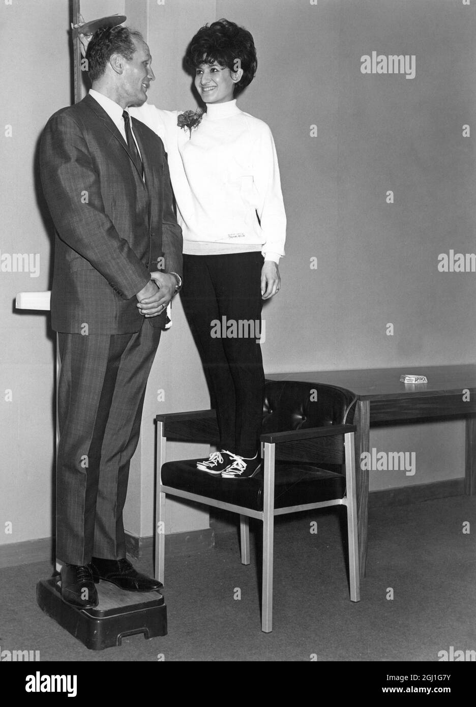 Club Instructioness Monique Farhi , who is 5ft 2 inches tall climbs on ...