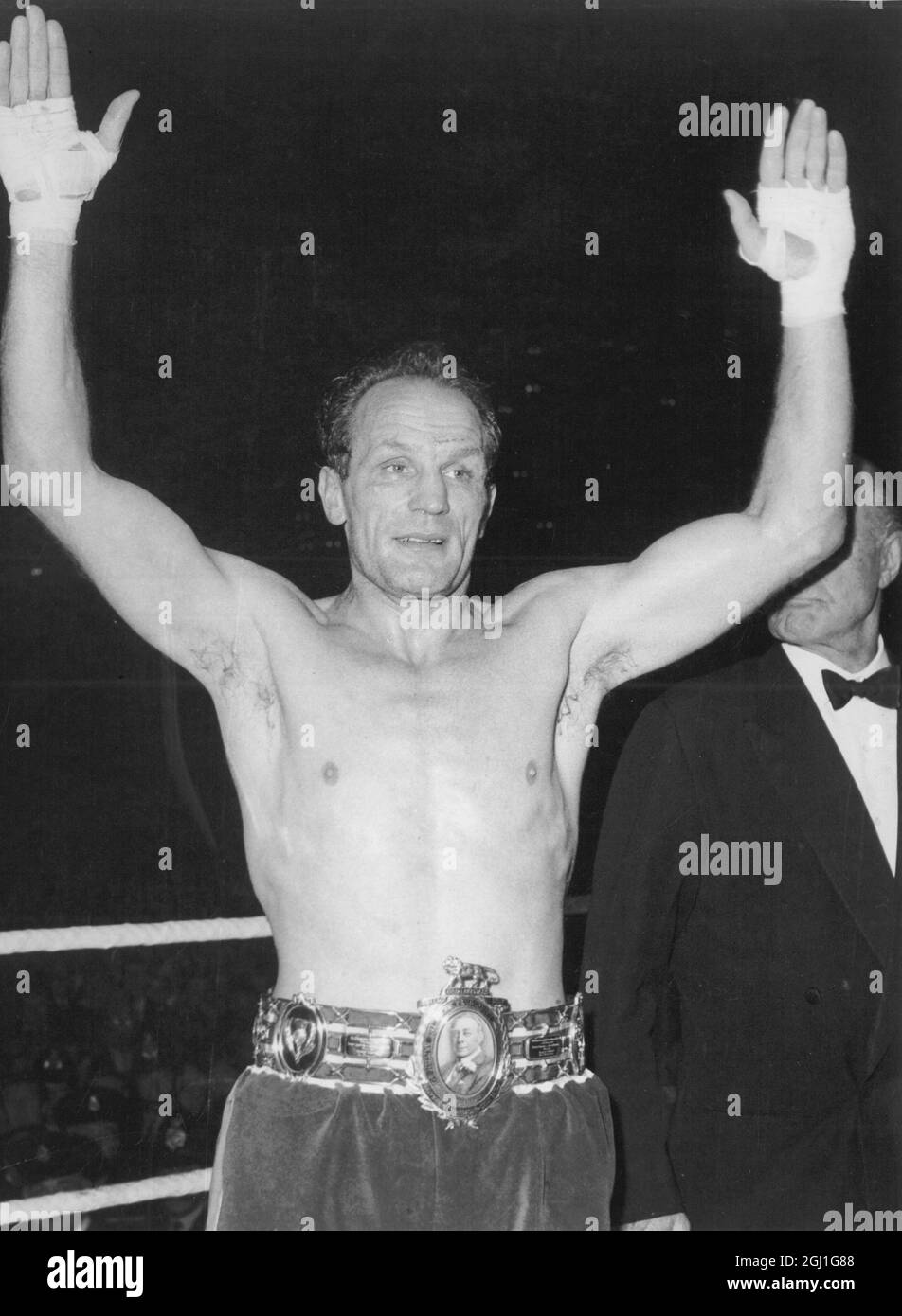 Henry Cooper acknowledges the cheers of the crowd , after receiving his ...