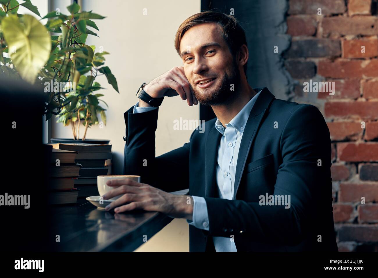 business man in a suit sitting in a cafe rest breakfast Stock Photo - Alamy