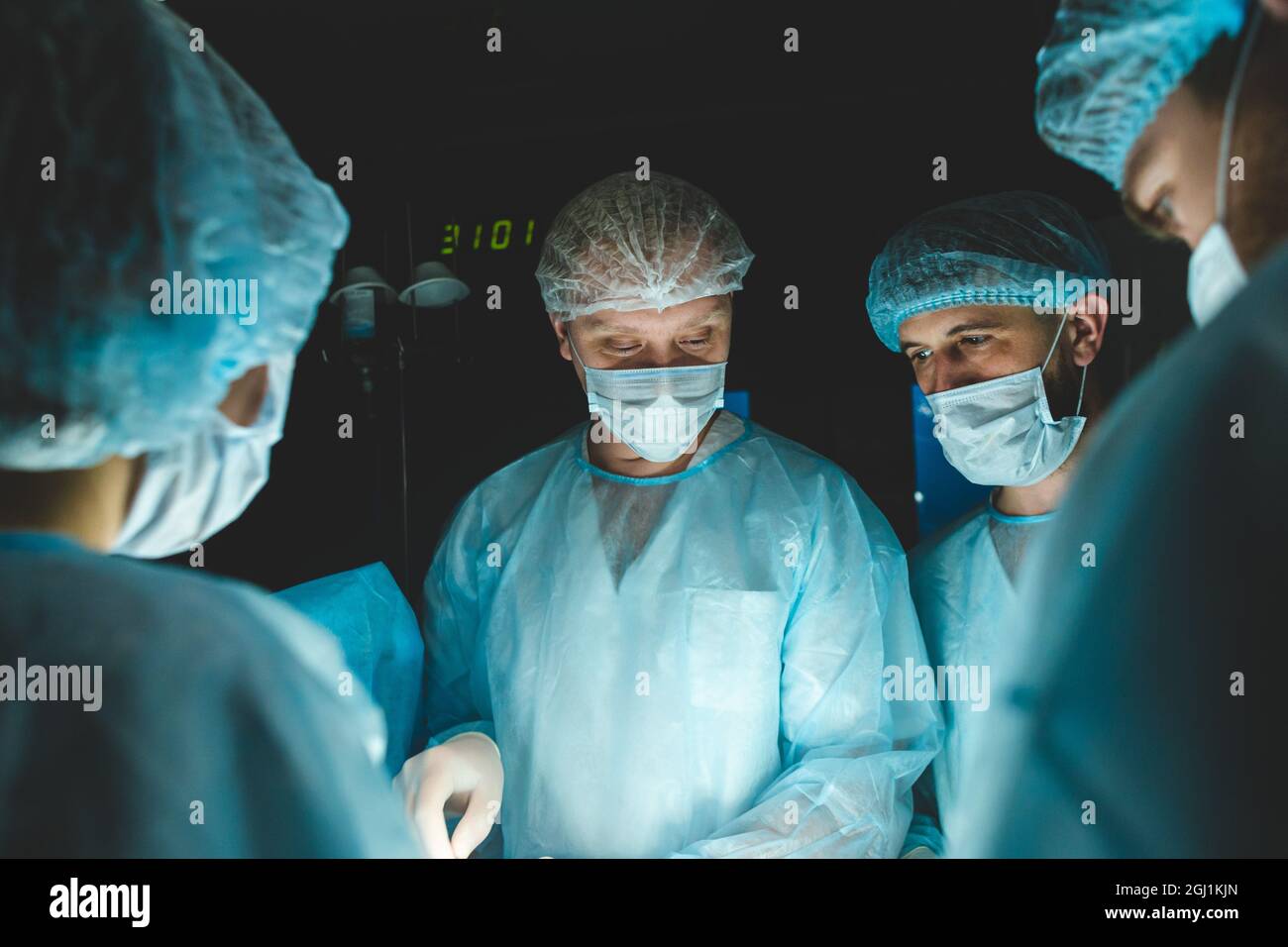 The senior surgeon in the operating room, where the patient is waiting ...
