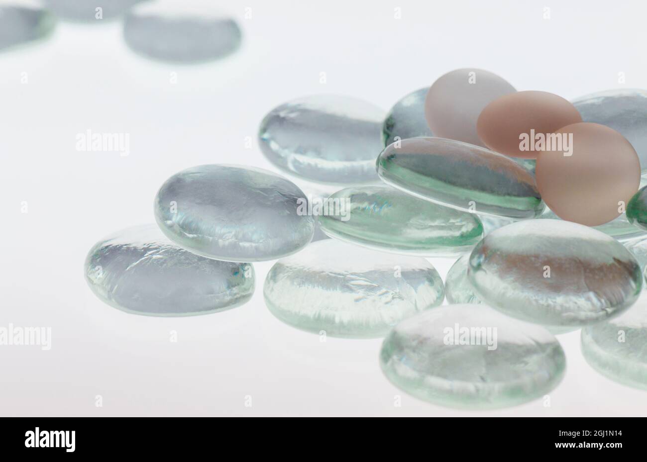 Clear Glass Pebbles with light Stock Photo - Alamy