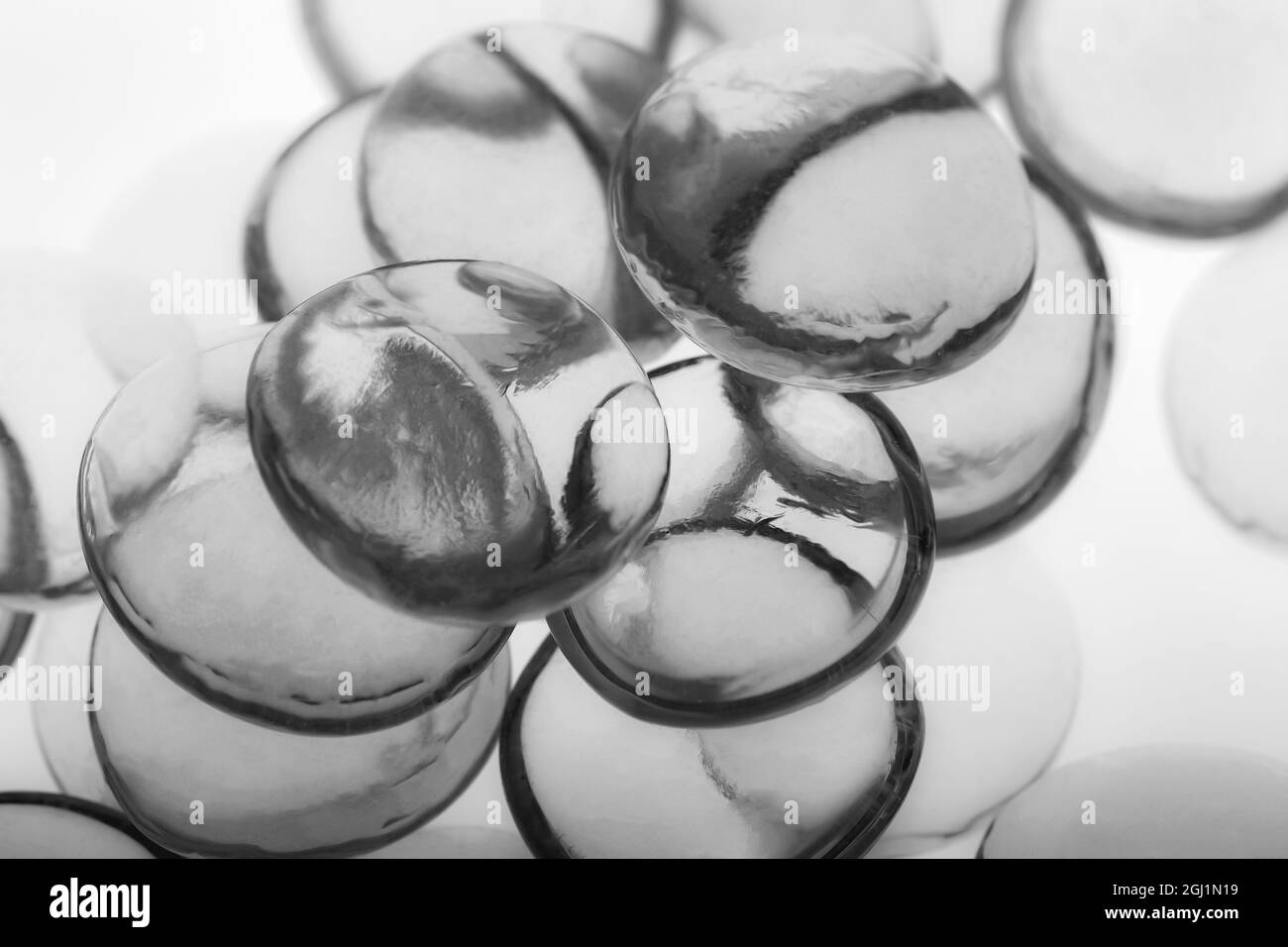 Clear Glass Pebbles with light Stock Photo - Alamy