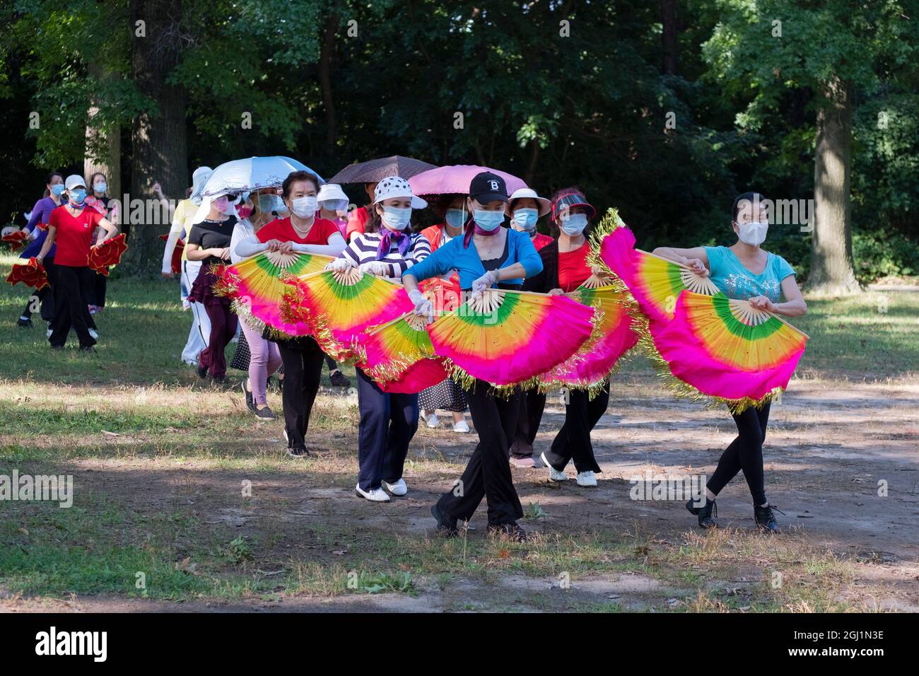 A group of women in a dance exercise class rehearse for a performance ...