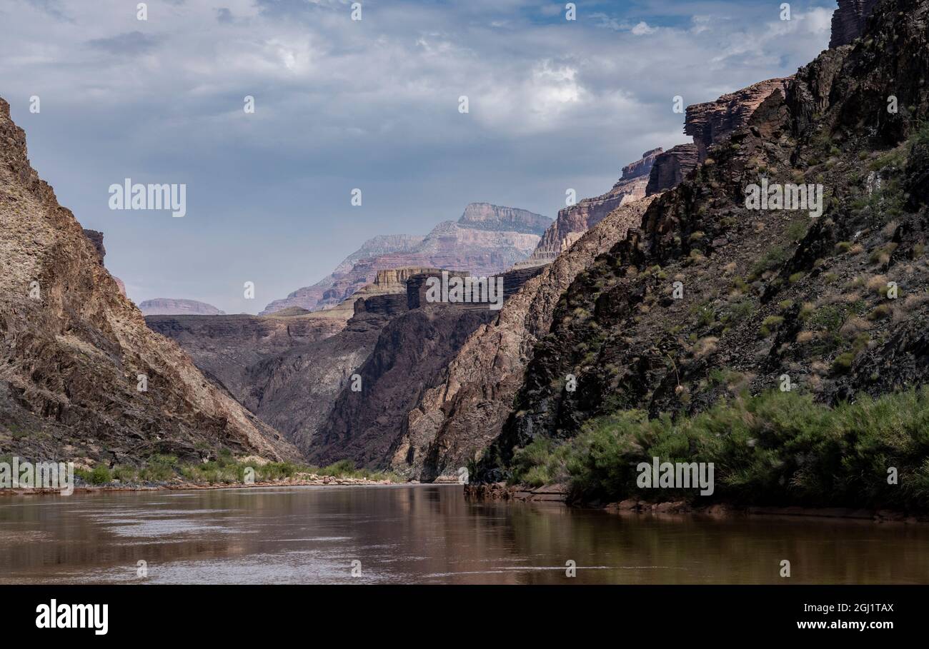 USA, Arizona. Floating down the Colorado River surrounded by canyon ...
