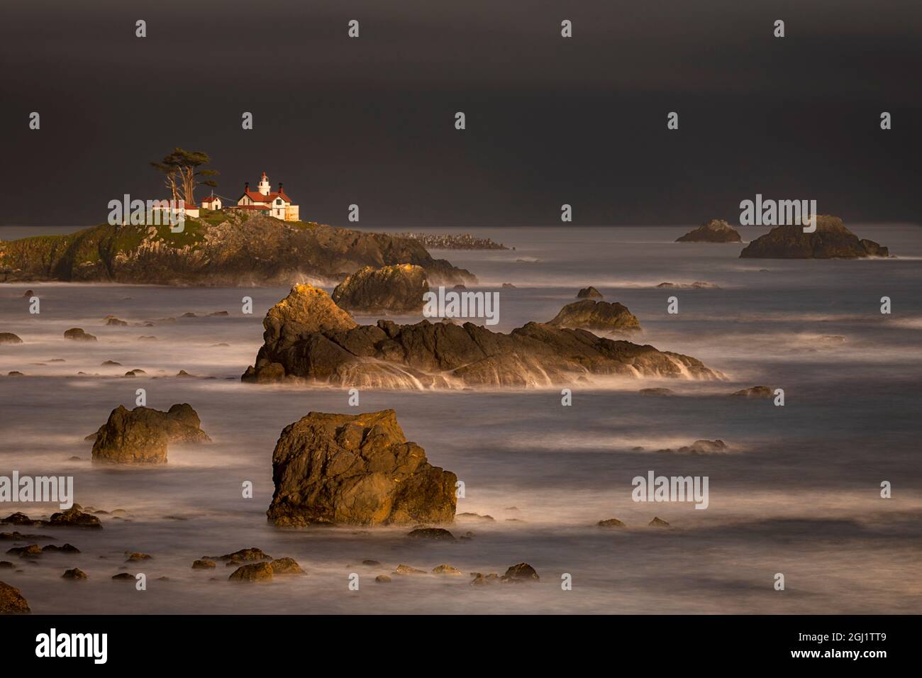 Battery Point Lighthouse and storm clouds at sunset, Crescent City ...
