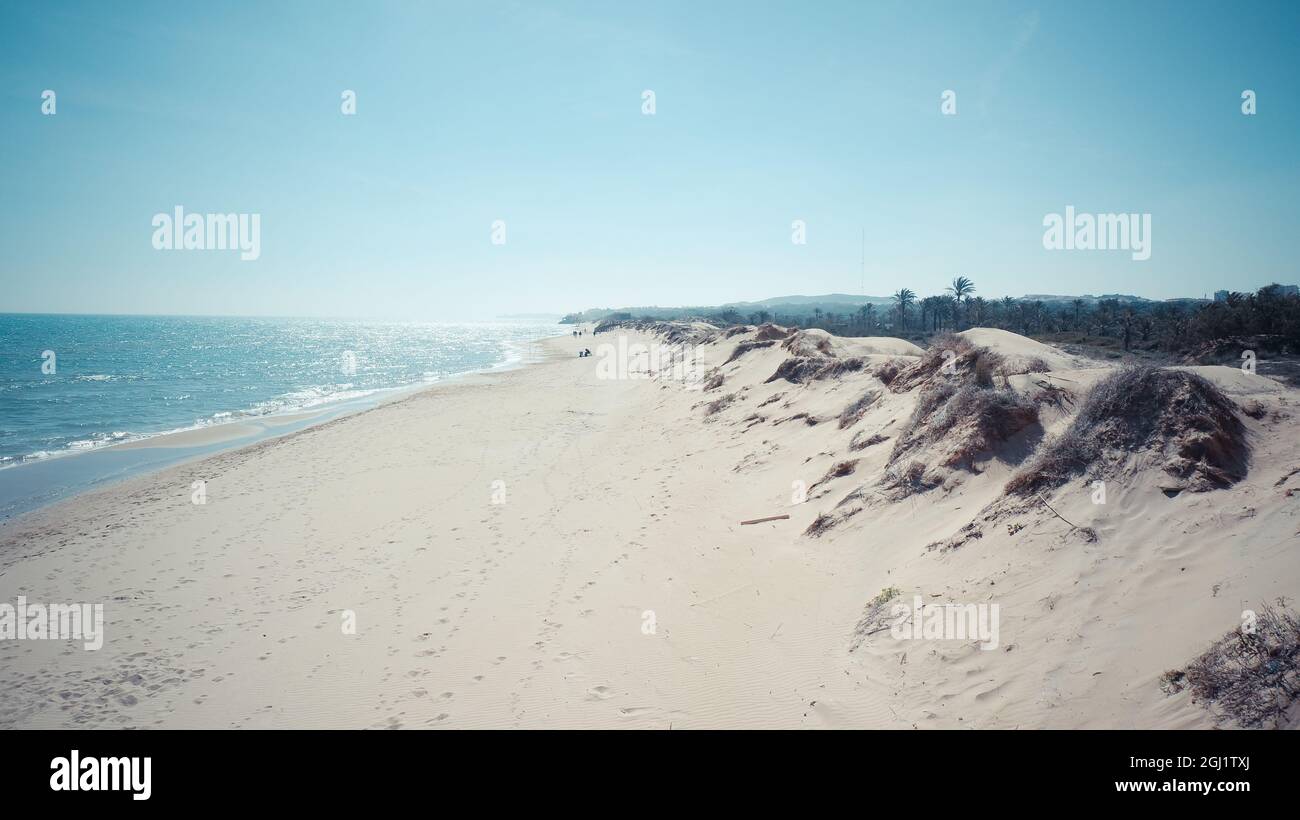 View to wide white sand Mediterranean sea beach in the morning ...