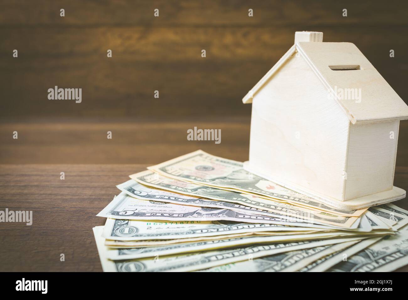 Money and house model on wooden background , Finance and banking ...
