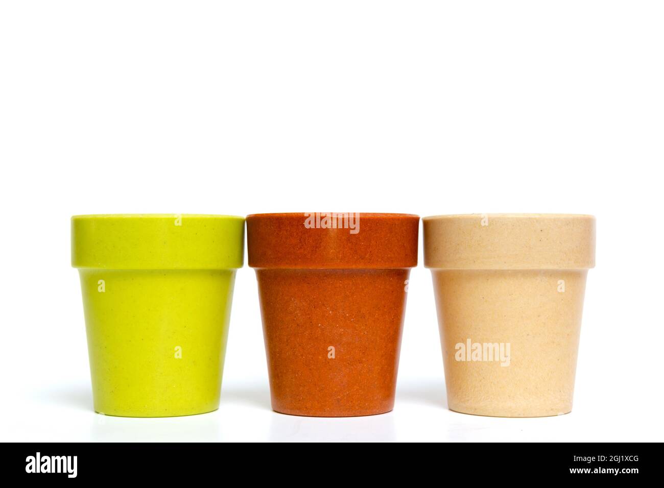 Recycled materials biodegradable tree pot isolated on a white ...