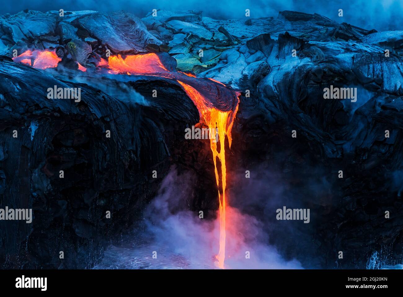 Lava flow entering the ocean at dawn, Hawaii Volcanoes National Park ...