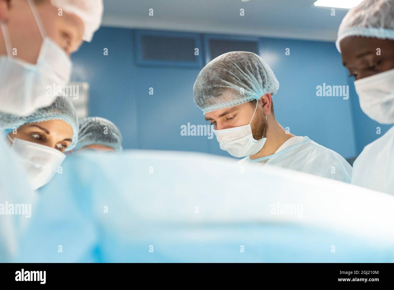 Portrait of a doctor during surgery in a uniform and medical mask Stock ...