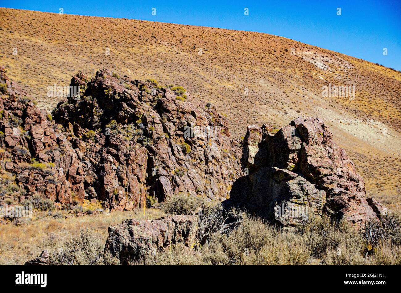 USA, California. Black Rock Desert, volcanic basalt with red-orange ...