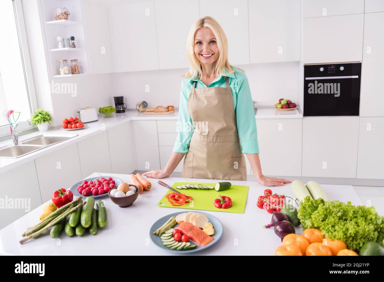 Photo of mature woman happy positive smile chef cook ingredient cuisine ...