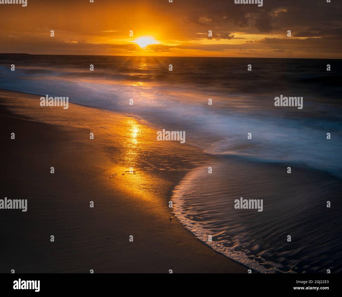 USA, New Jersey, Cape May National Seashore. Sunrise on ocean and beach ...