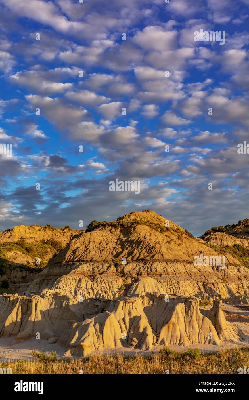 Dramatic sunrise clouds over badlands formations in Theodore Roosevelt ...