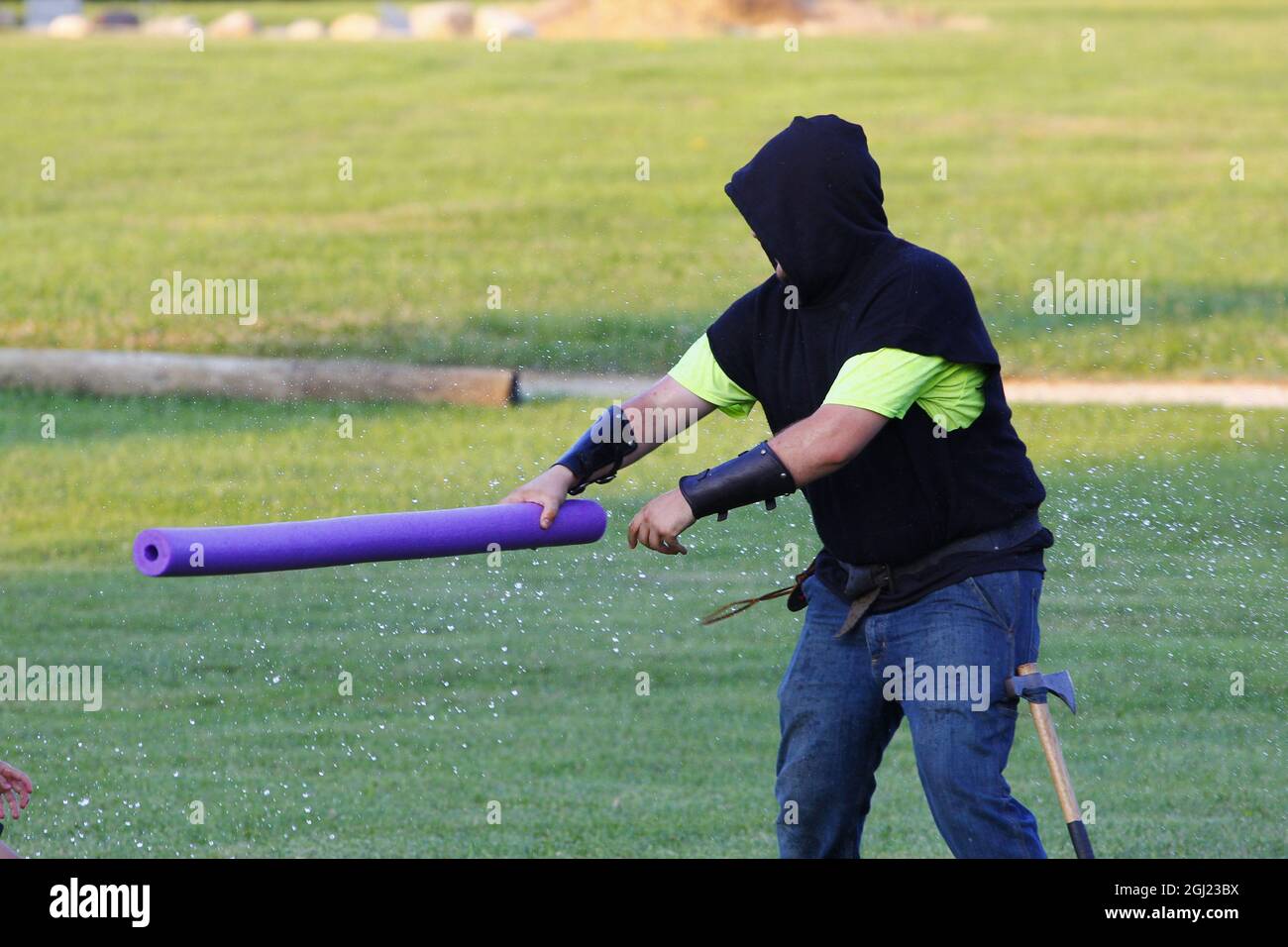 Hooded Man Playing a Game Stock Photo - Alamy