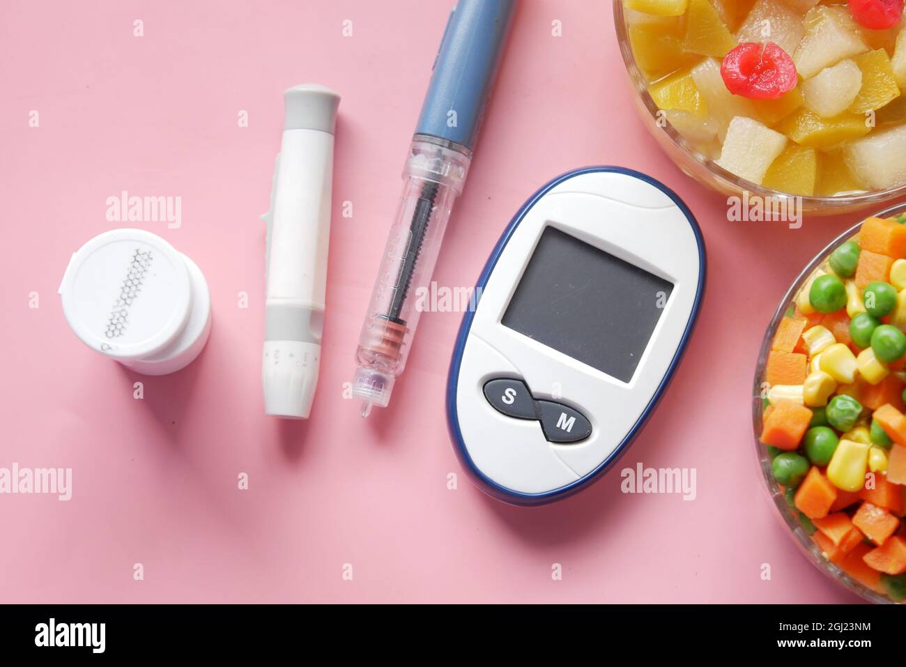 diabetic measurement tools and insulin pen and healthy food on table ...