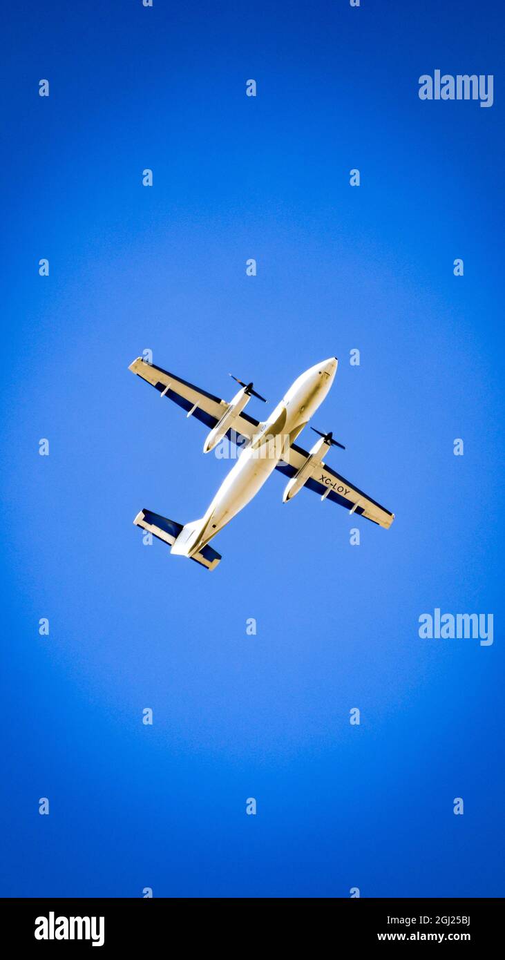 MEXICO, MEXICO - May 28, 2021: A vertical low angle shot of a plane ...