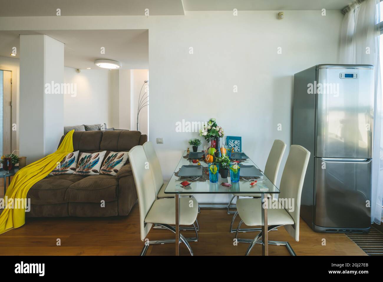 Modern studio apartment interior. Luxury flat. Cozy sofa with cushions ...