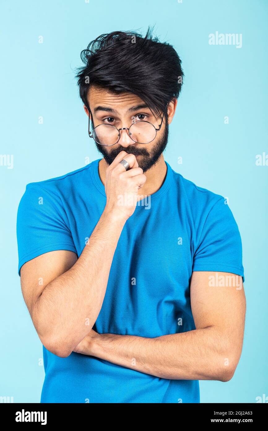 Emotional portrait of a handsome Hindu man in a blue T-shirt on a ...