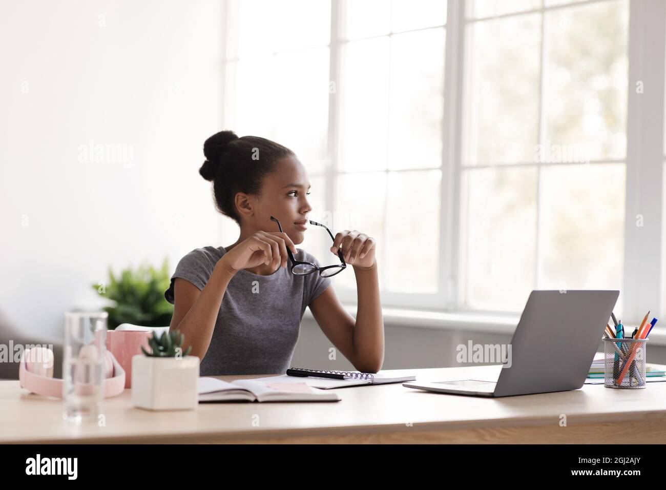 Teenage african american school student distance e learning with online ...