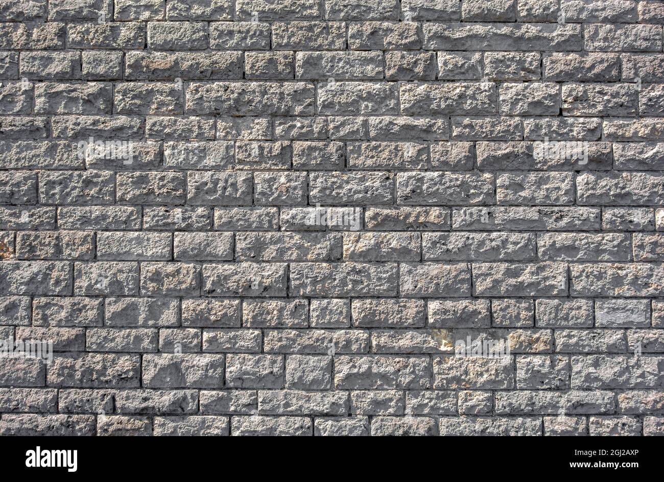 Full frame sunny illuminated light grey stone wall background Stock ...