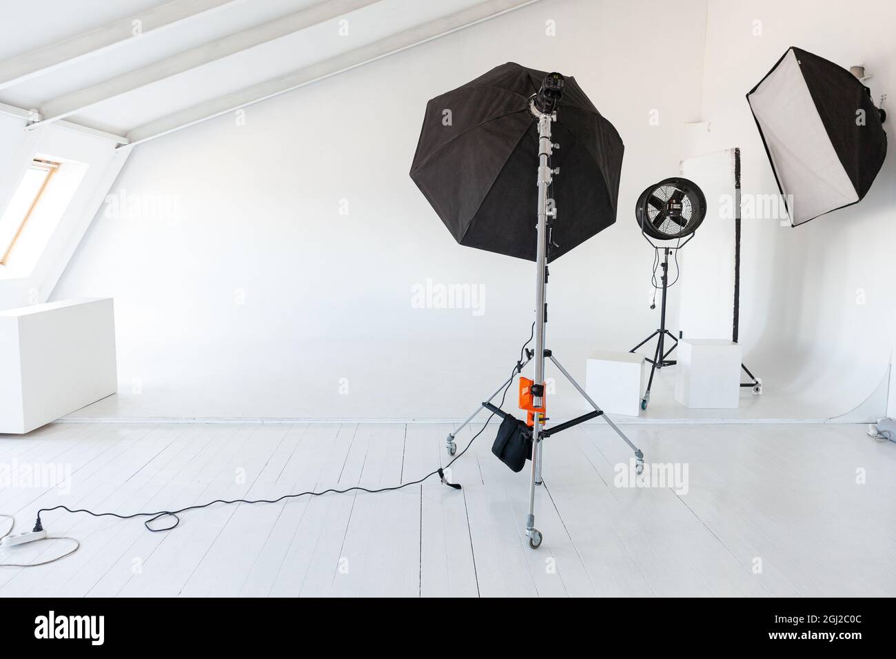 Empty photo studio with lighting equipment. Photographer workplace ...