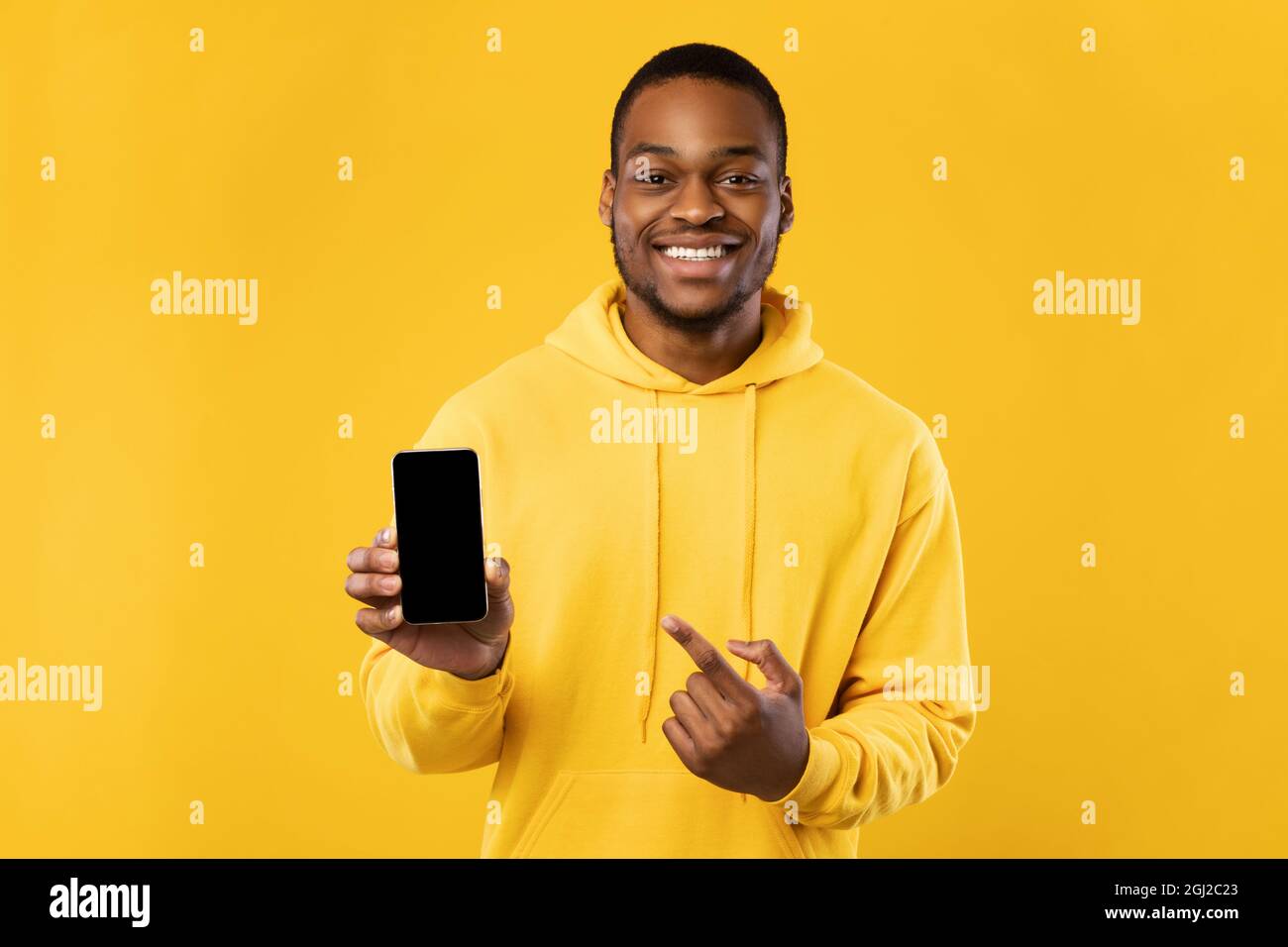 Check This Mobile Application. Black Man Showing Phone Pointing Finger ...