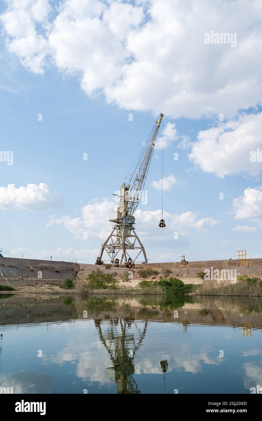 Heavy large industrial crane lifter at abounded port in sunny day Stock ...