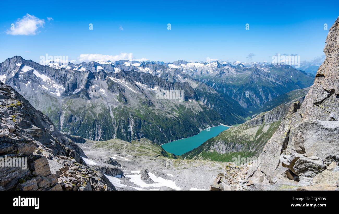 Summer alpine scenery with turquoise blue water reservoir. Zillertal ...