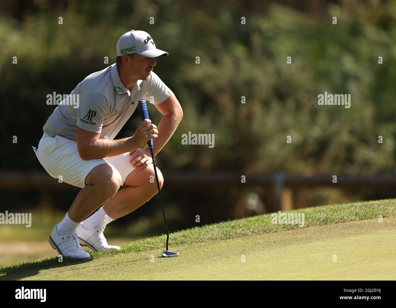 Barney Davis putts on the 12th green during the Pro-Am for the BMW PGA ...