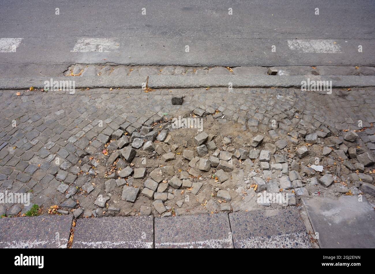 Damaged cobblestone road pavement hi-res stock photography and images ...