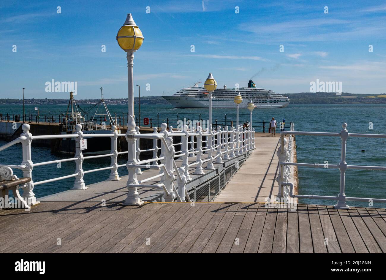 View of Torquay Inner Harbour Walkway With White Railings and a Moored ...