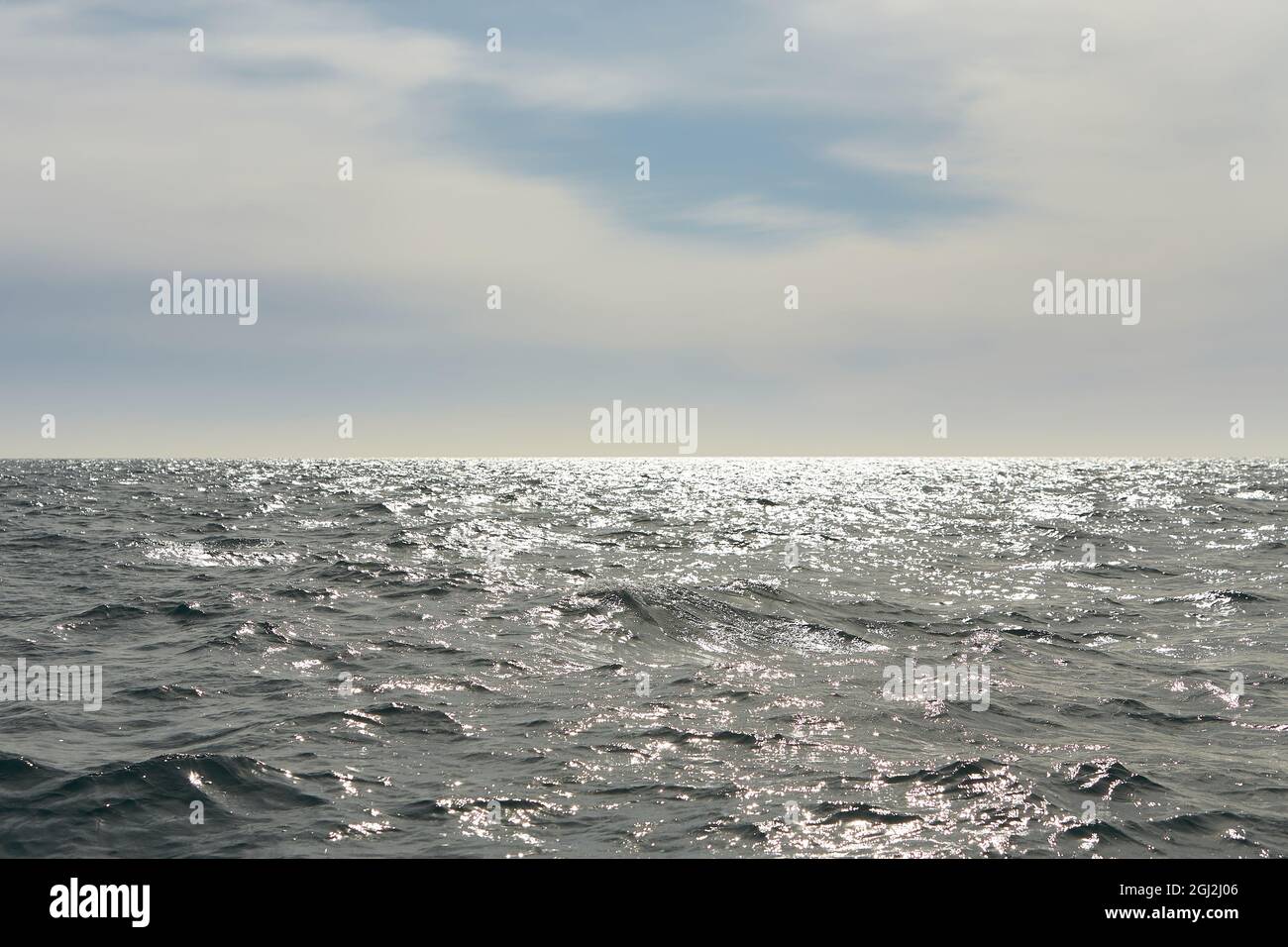 Detail of a sunlight reflecting in glittering sea. sparkler in water ...